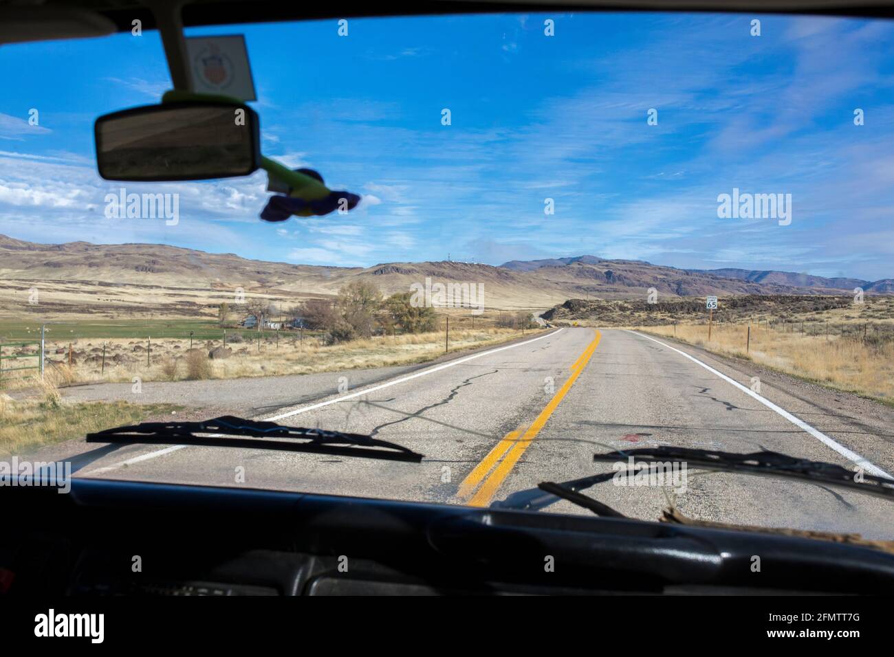 A view of the open road in Idaho through windshield of VW camper Stock ...