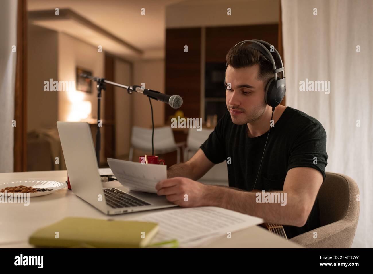 Man writing song in home studio Stock Photo - Alamy