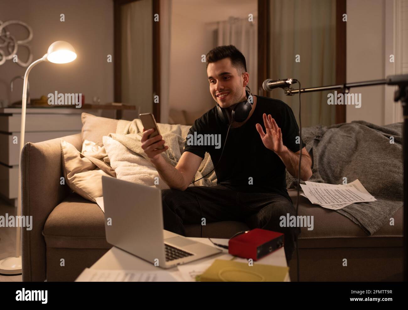 Friendly musician making video call Stock Photo - Alamy