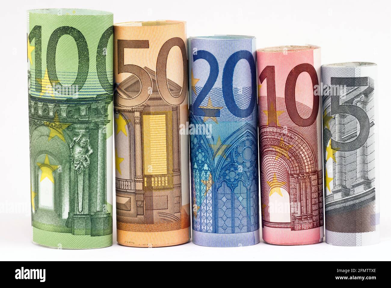 Rolls of various Euro banknotes isolated on white Stock Photo - Alamy