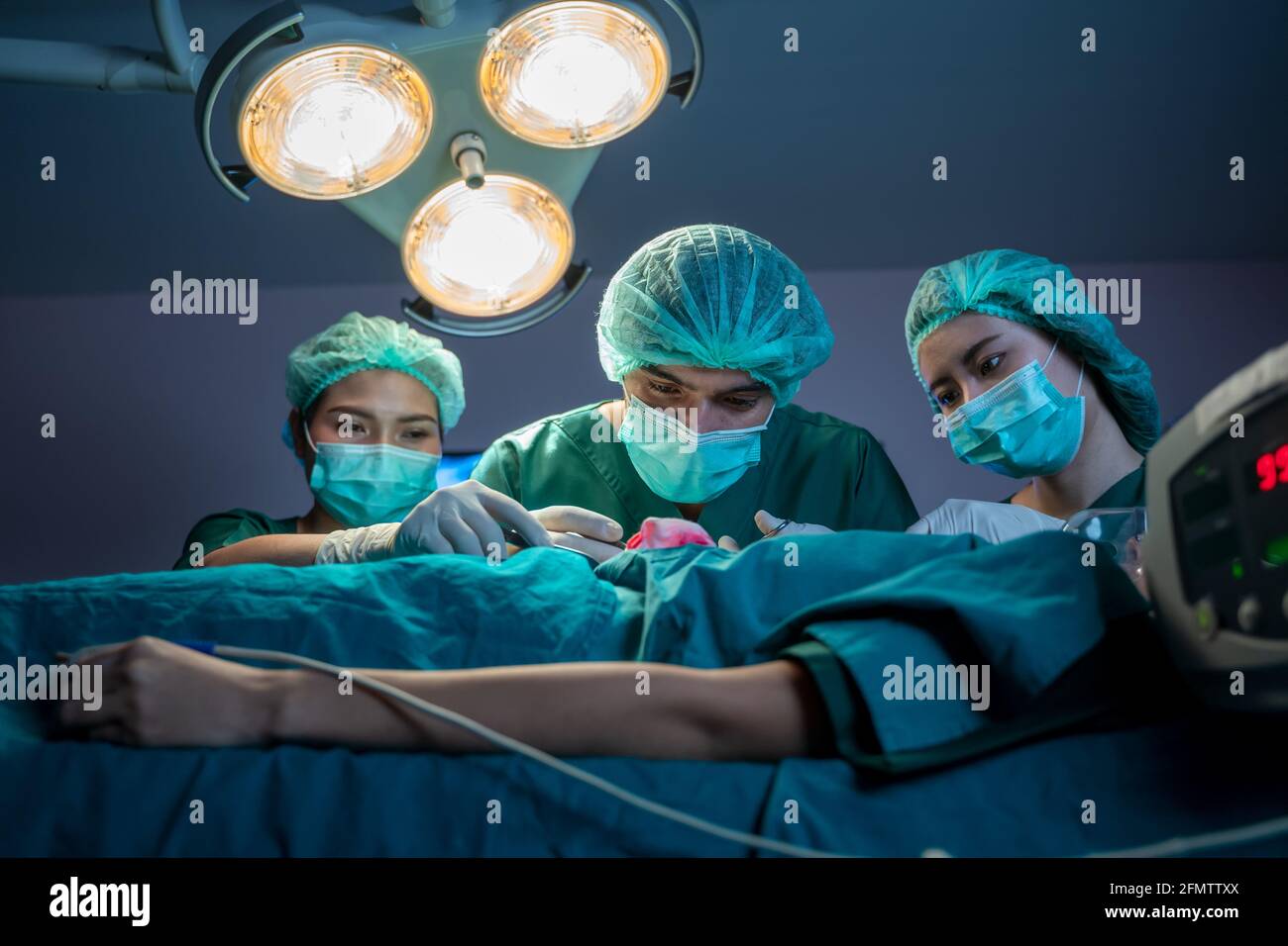 Teamwork In The Operating Room High Resolution Stock Photography and ...