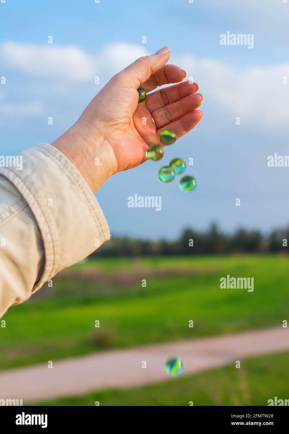 Hand Holding Marbles High Resolution Stock Photography and Images - Alamy