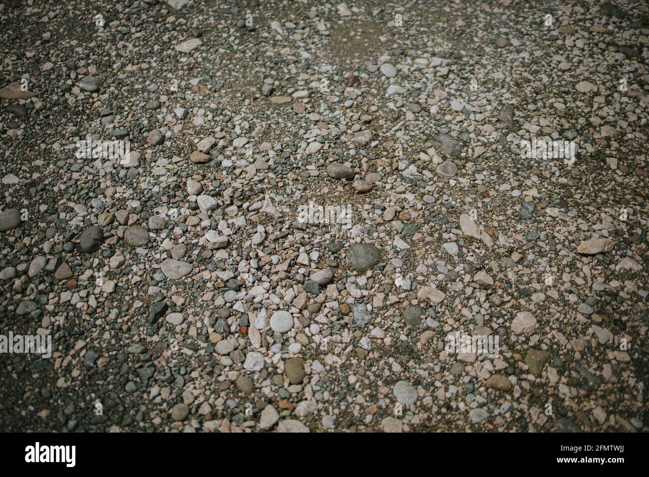 Stony ground background - a closeup of a rocky ground filled with ...