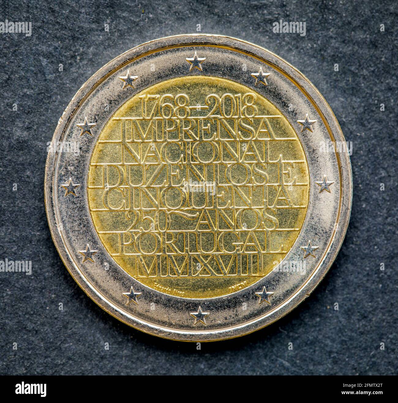 National side of two euro coin issued by Portugal isolated on a black ...