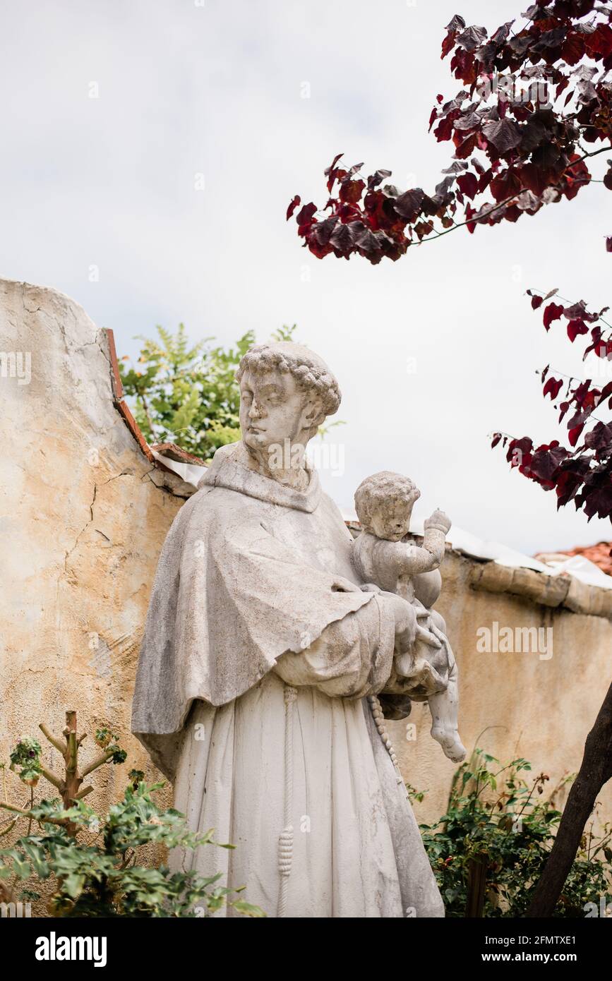 Statue of catholic priest hi-res stock photography and images - Alamy