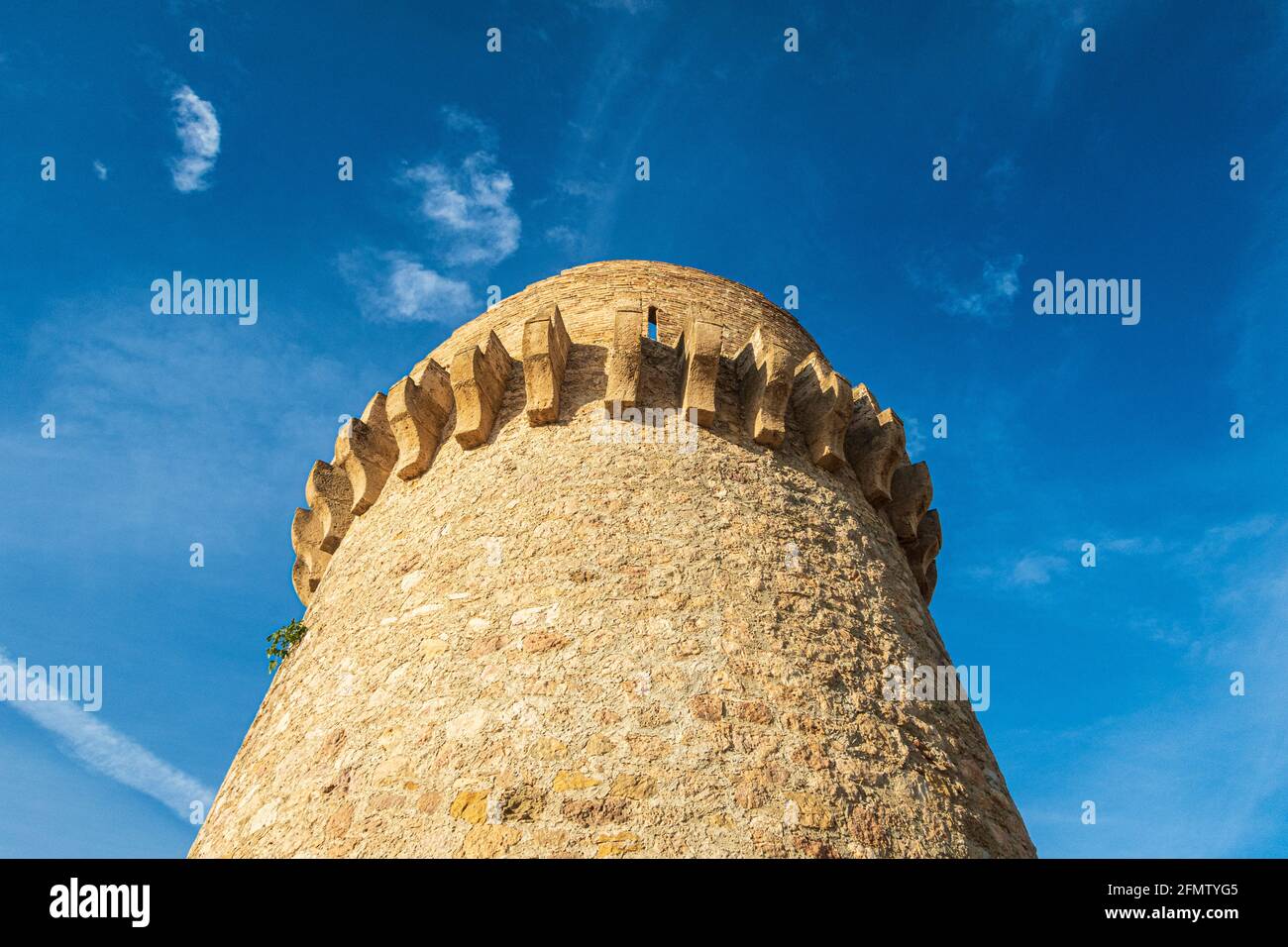 Low angle shot of the Torre de Piles on the Piles Beach under a blue ...