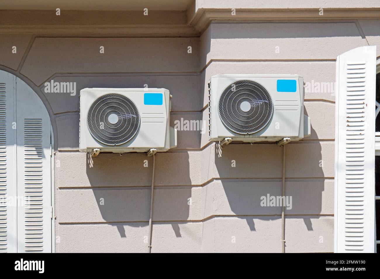 Air conditioner outdoor units on building facade wall Stock Photo - Alamy