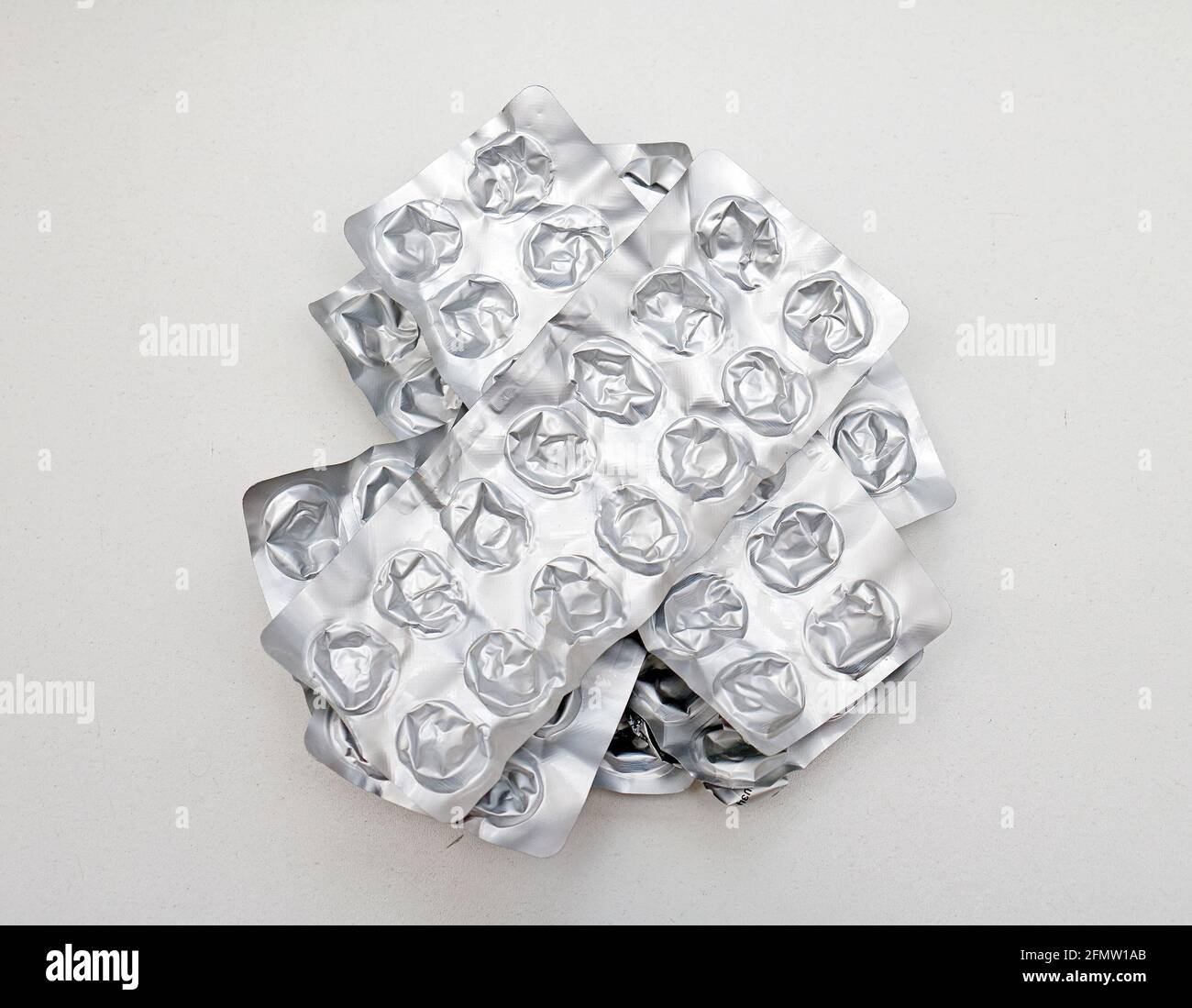 Used silver medicine pills blisters pile on white background Stock ...
