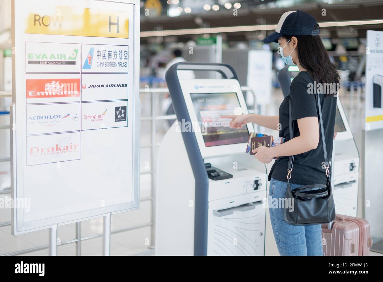 BANGKOK THAILAND APR 14 2021 Female hand using the auto self service ...
