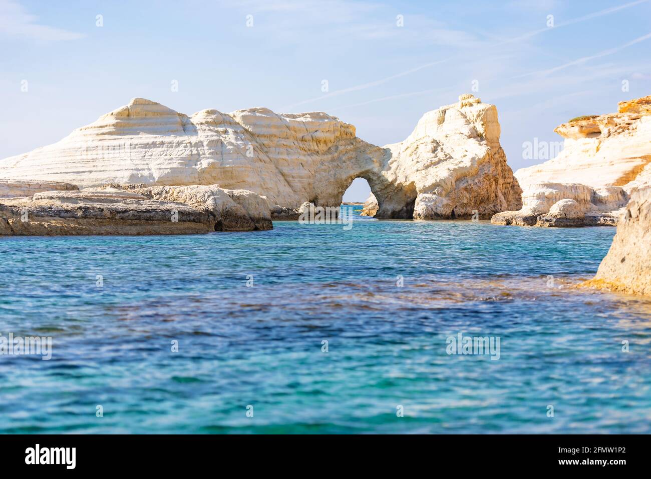 Bays and bays of Cyprus. Rocks with a through passage. Blue waters of ...