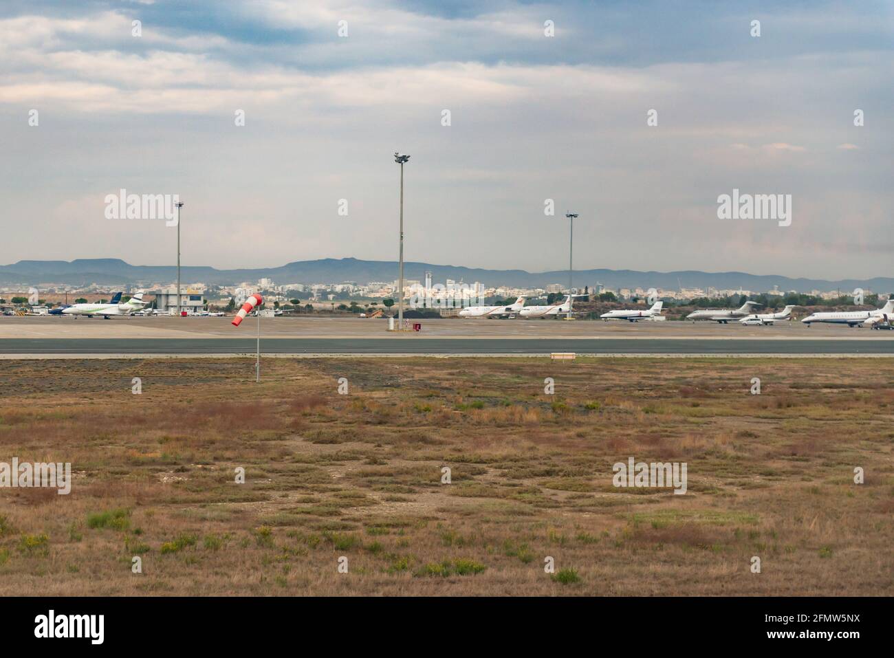 Paphos Airport in Cyprus. Planes on the runway and at the hangars ...