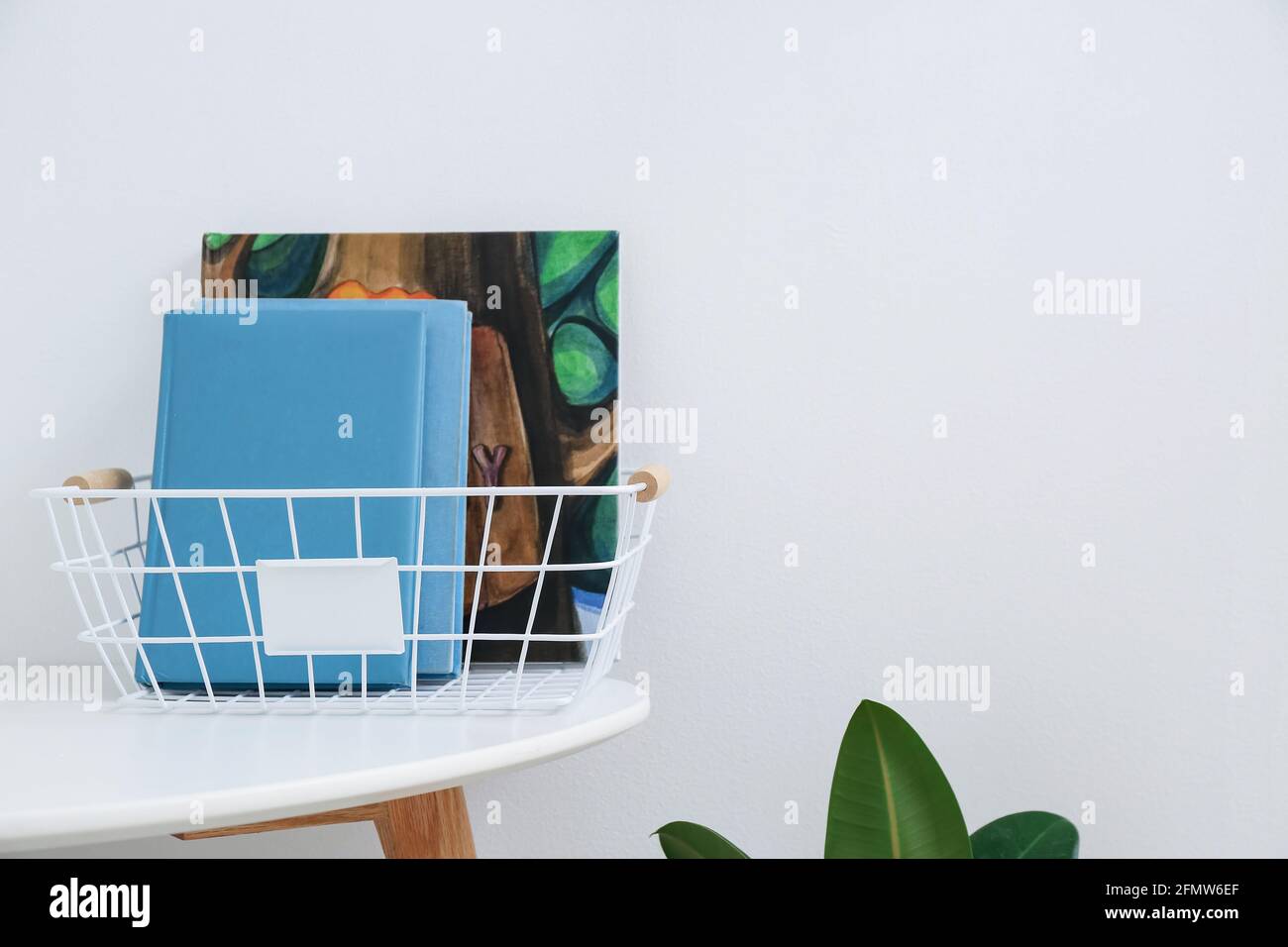Books on table in interior of modern children's room Stock Photo - Alamy