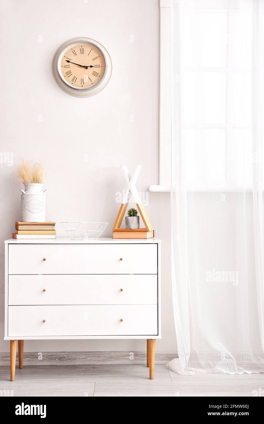 Interior of modern room with chest of drawers Stock Photo - Alamy