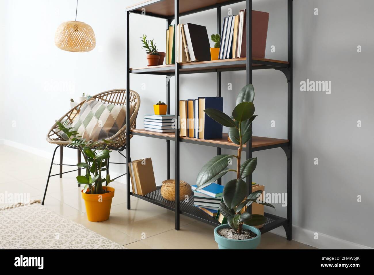 Interior of modern room with shelf unit and chair Stock Photo - Alamy