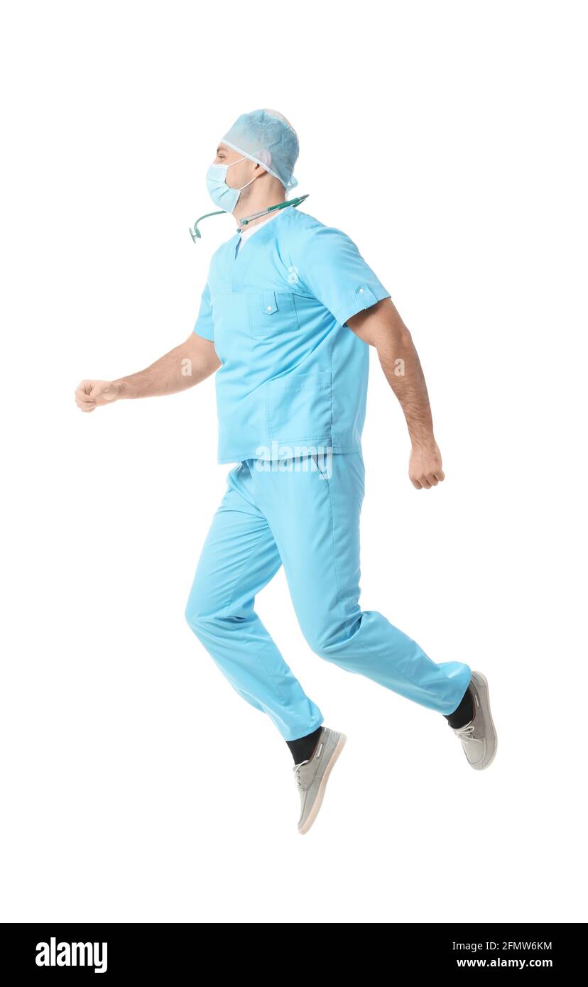 Jumping male doctor on white background Stock Photo - Alamy