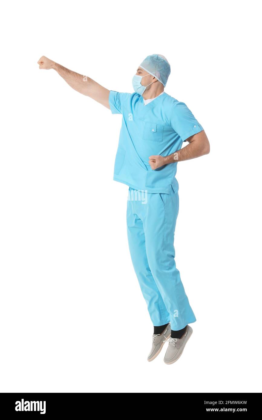 Jumping male doctor on white background Stock Photo - Alamy