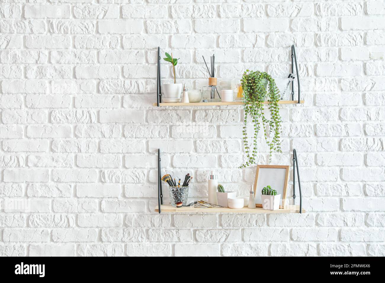 Hanging shelves on brick wall hi-res stock photography and images - Alamy