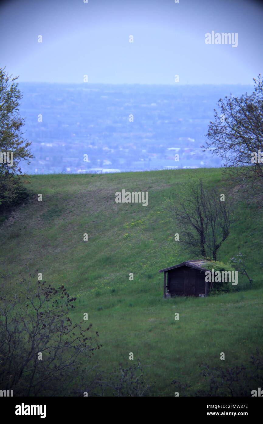Wooden shack on a hill seen from the distance Stock Photo - Alamy