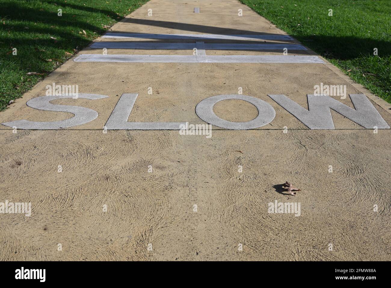 The Word Slow Written Across A Path In Giant Letters Stock Photo Alamy the-word-slow-written-across-a-path-in-giant-letters-stock-photo-alamy