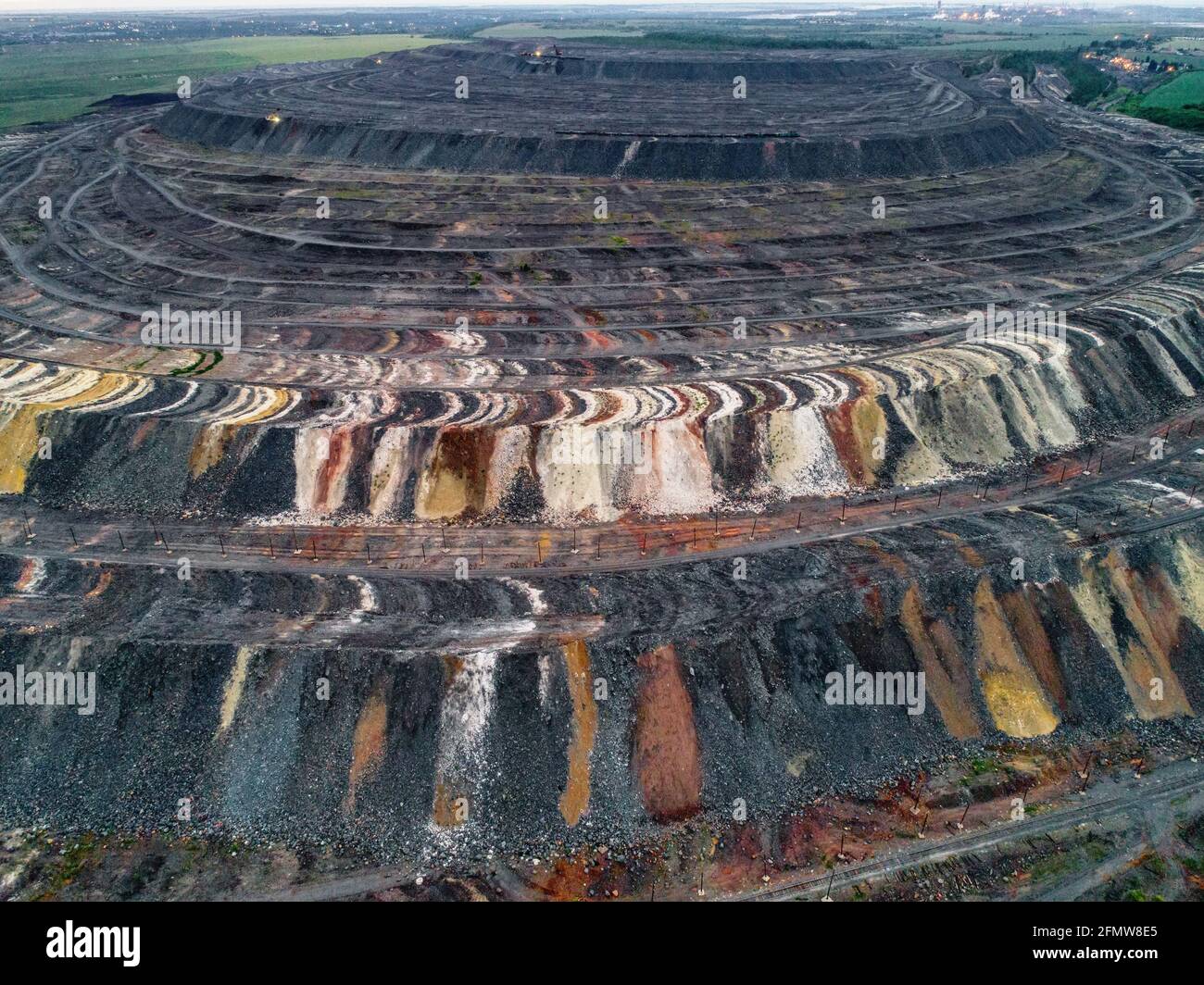 Huge mound of waste rocks. Industrial dump of a mining quarry ...