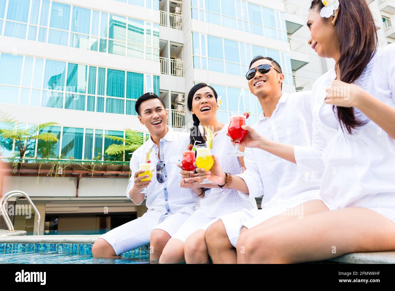 Friends at swimming pool hi-res stock photography and images - Alamy