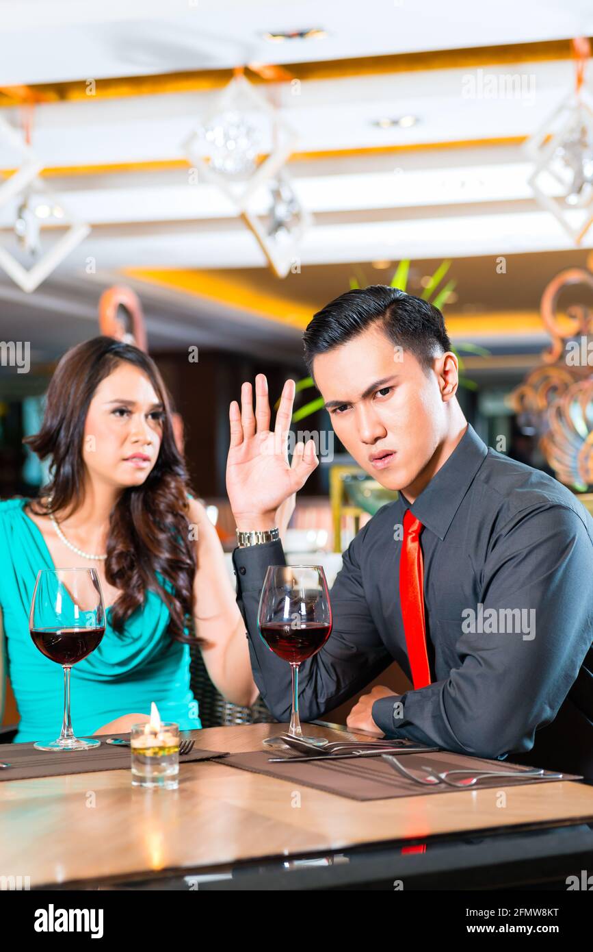 Angry young couple arguing restaurant hi-res stock photography and ...