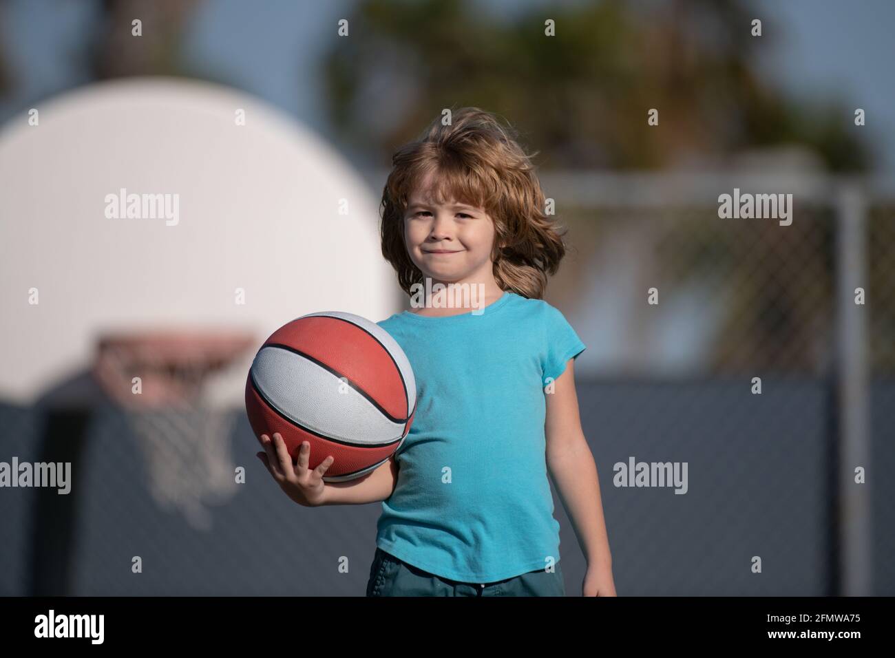 Child basketball. Kid boy concentrated on playing basket ball Stock ...
