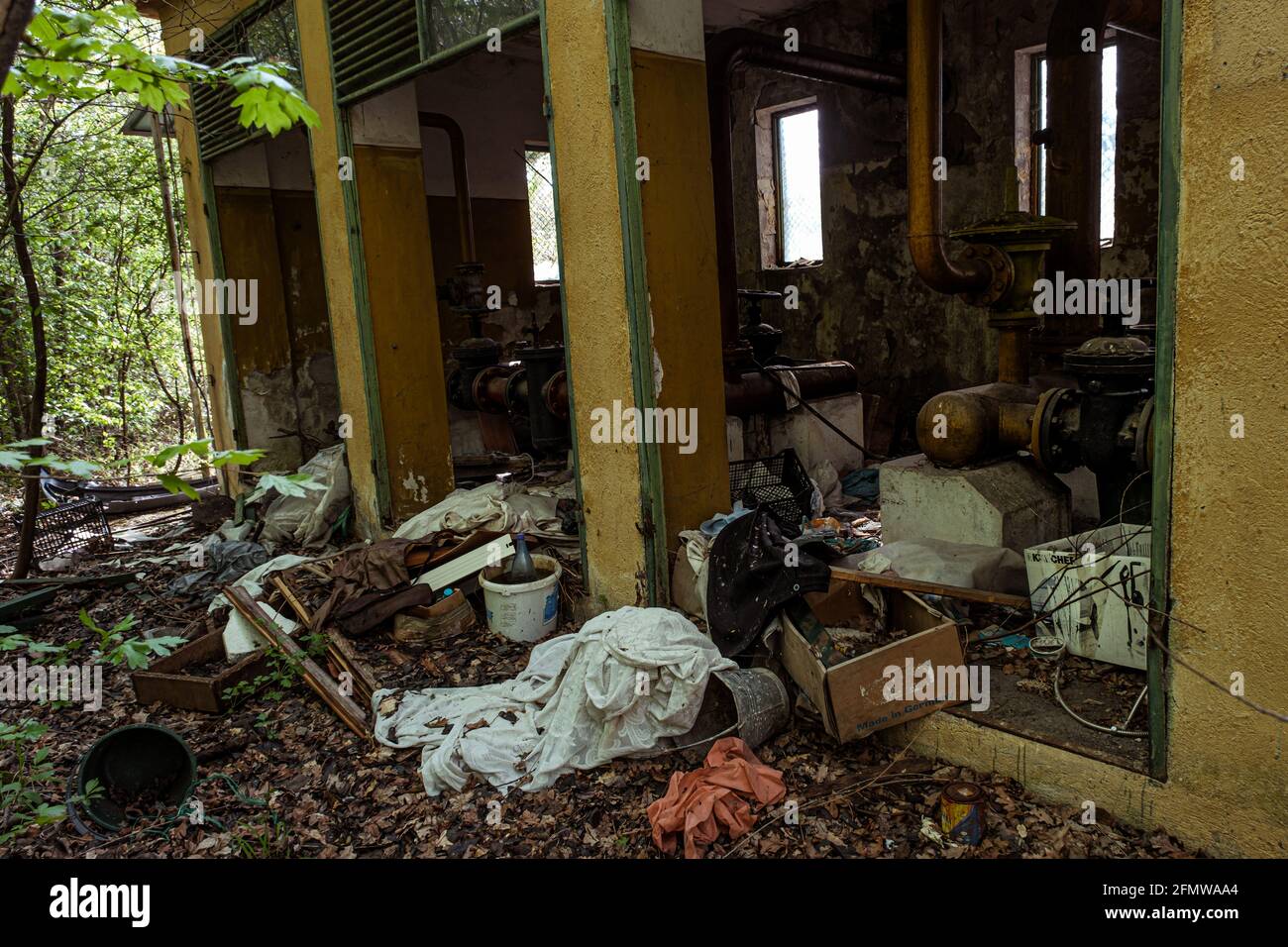 abandoned industrial area with pipes and taps Stock Photo - Alamy
