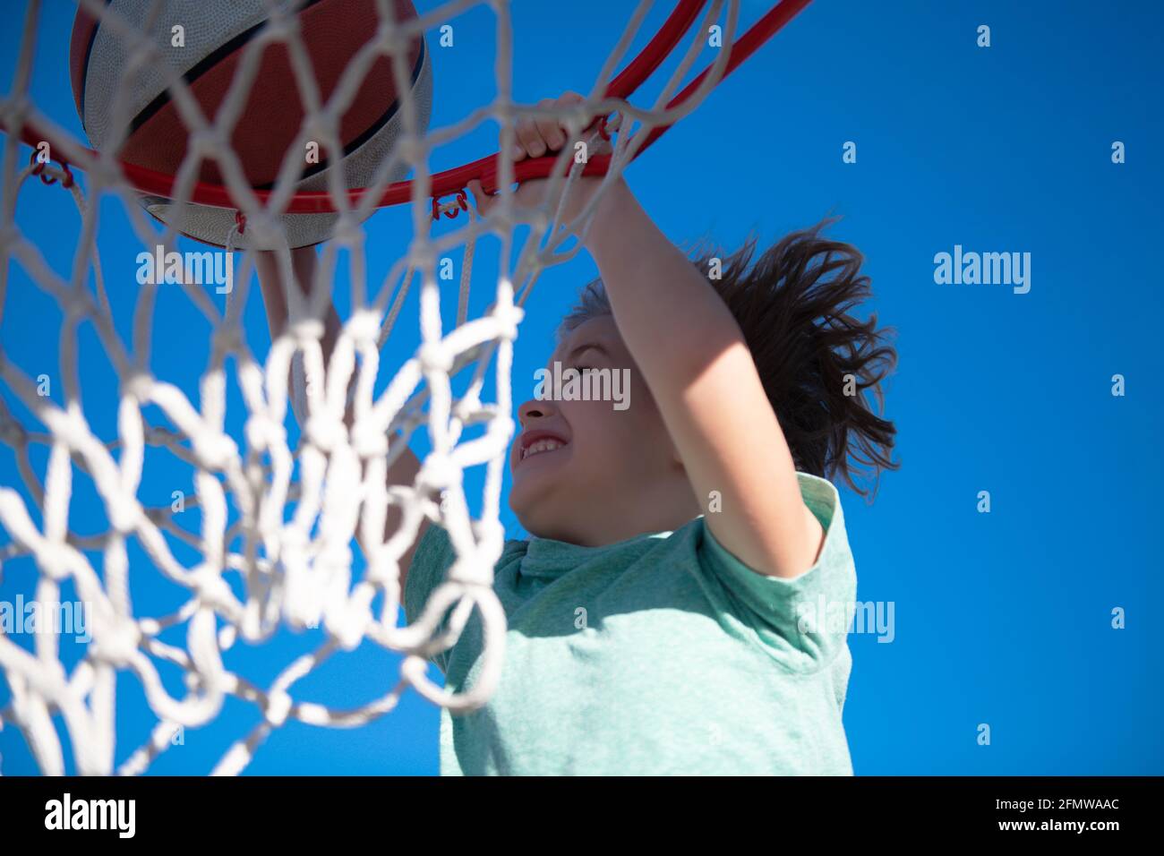 Basketball kids game. Cute little child boy holding a basket ball ...