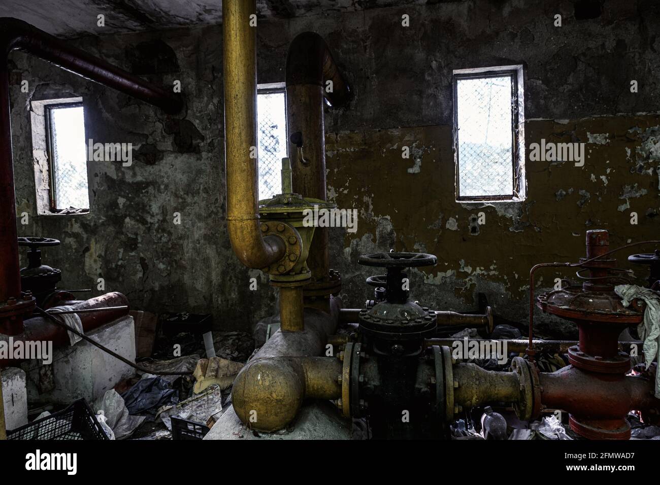 abandoned industrial area with pipes and taps Stock Photo - Alamy