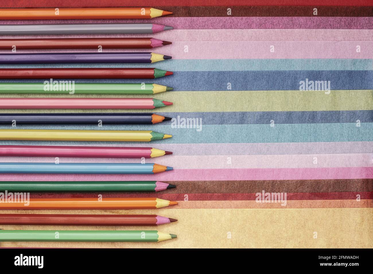 colored pencils on colored paper background Stock Photo - Alamy