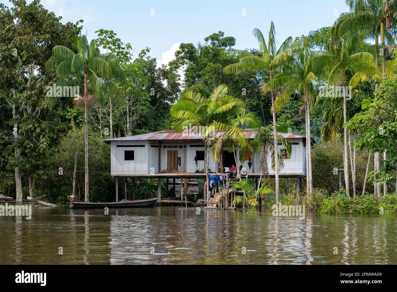 Homes on stilts dot the Amazon River in Peru Stock Photo - Alamy