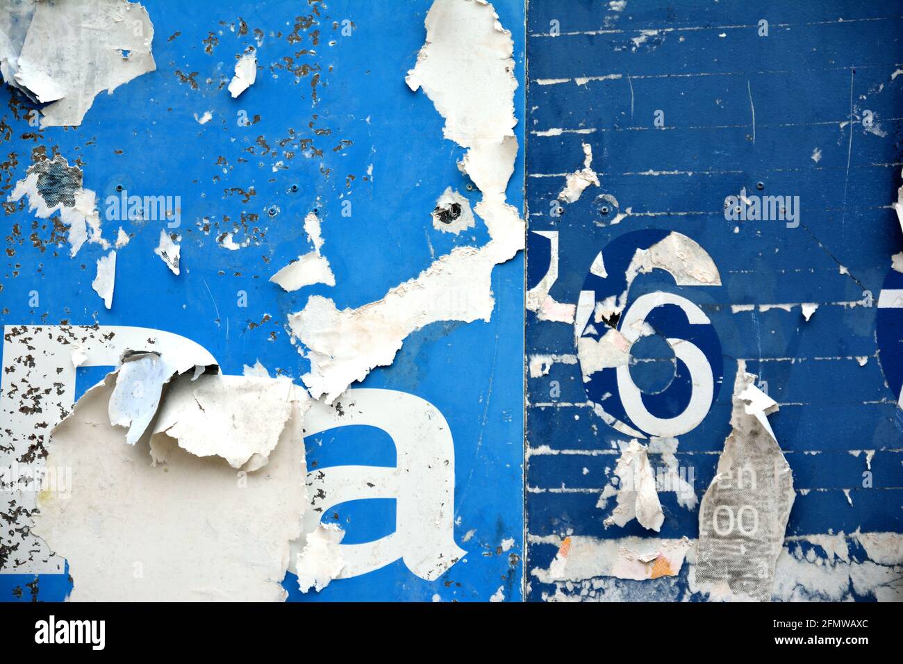 Detail of peeling blue paper on a weathered billboard Stock Photo - Alamy