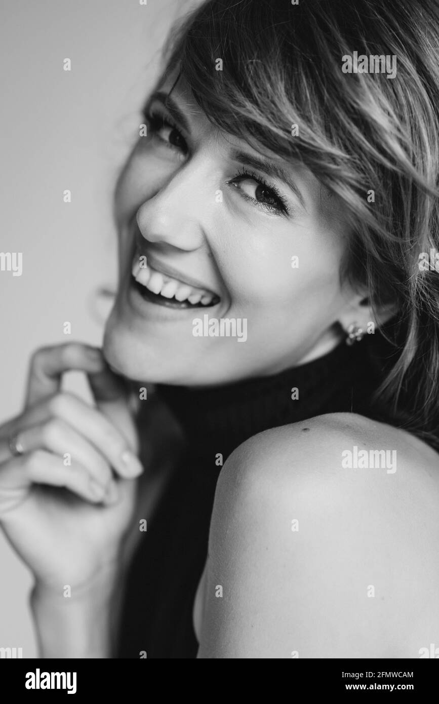 Portrait of a beautiful girl 36 years old with curly hair and an open ...