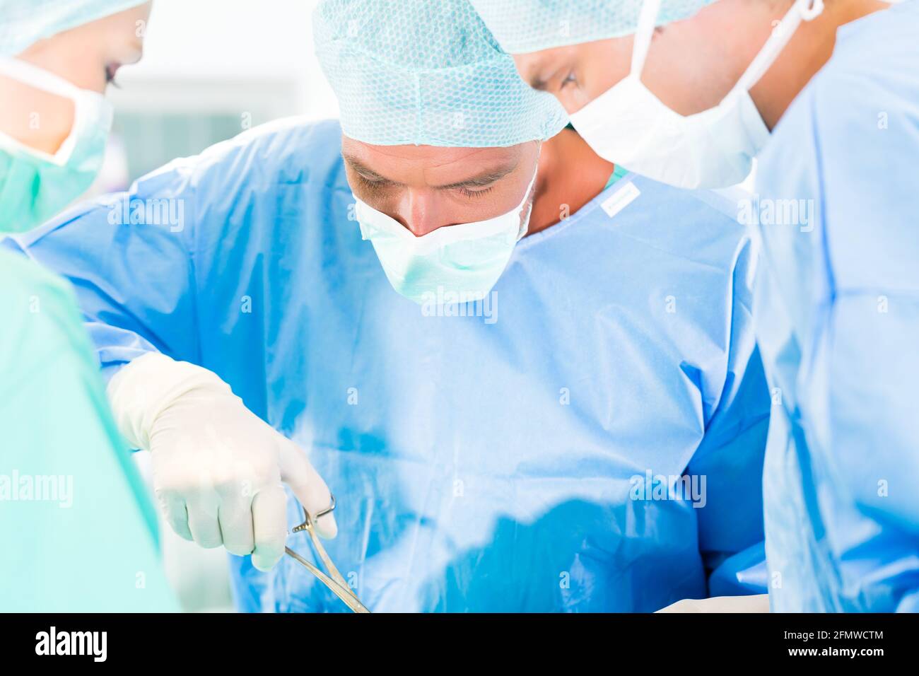 Hospital - surgery team in the operating room or Op of a clinic ...