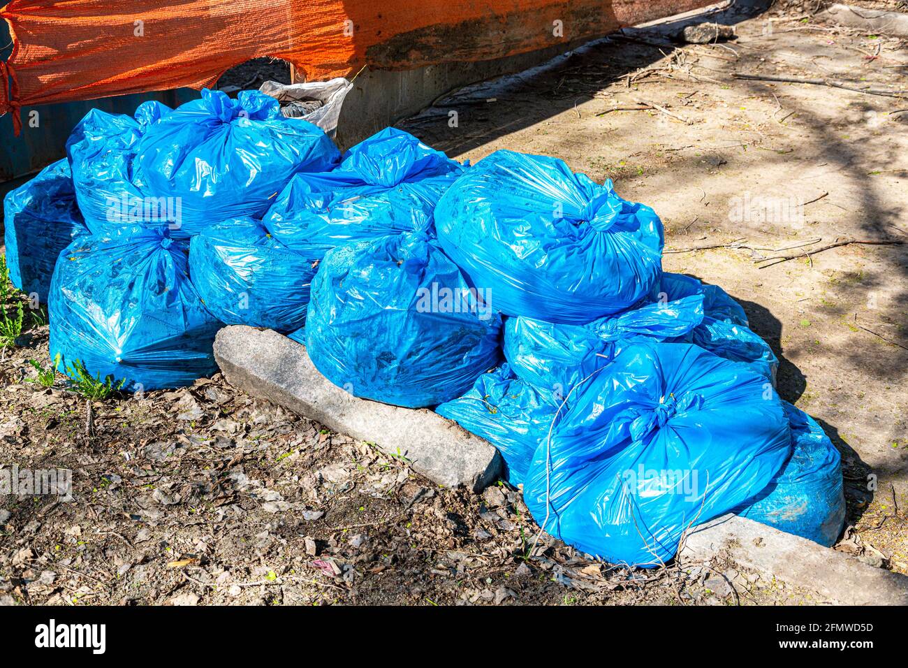 Blue garbage bags piled in a pile. Concept of environment and ecology ...