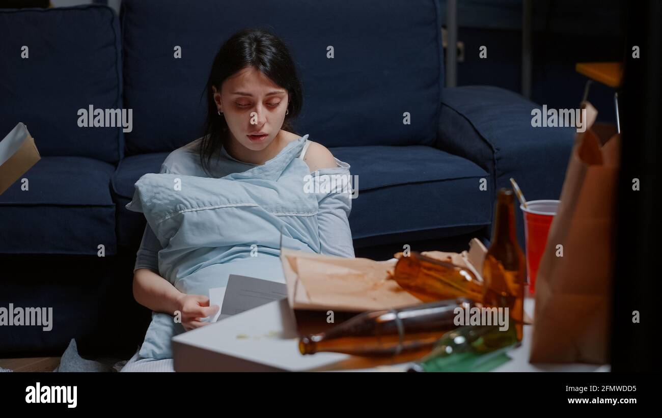 Annoyed, frustrated, stressed, depressed woman reading eviction notice ...