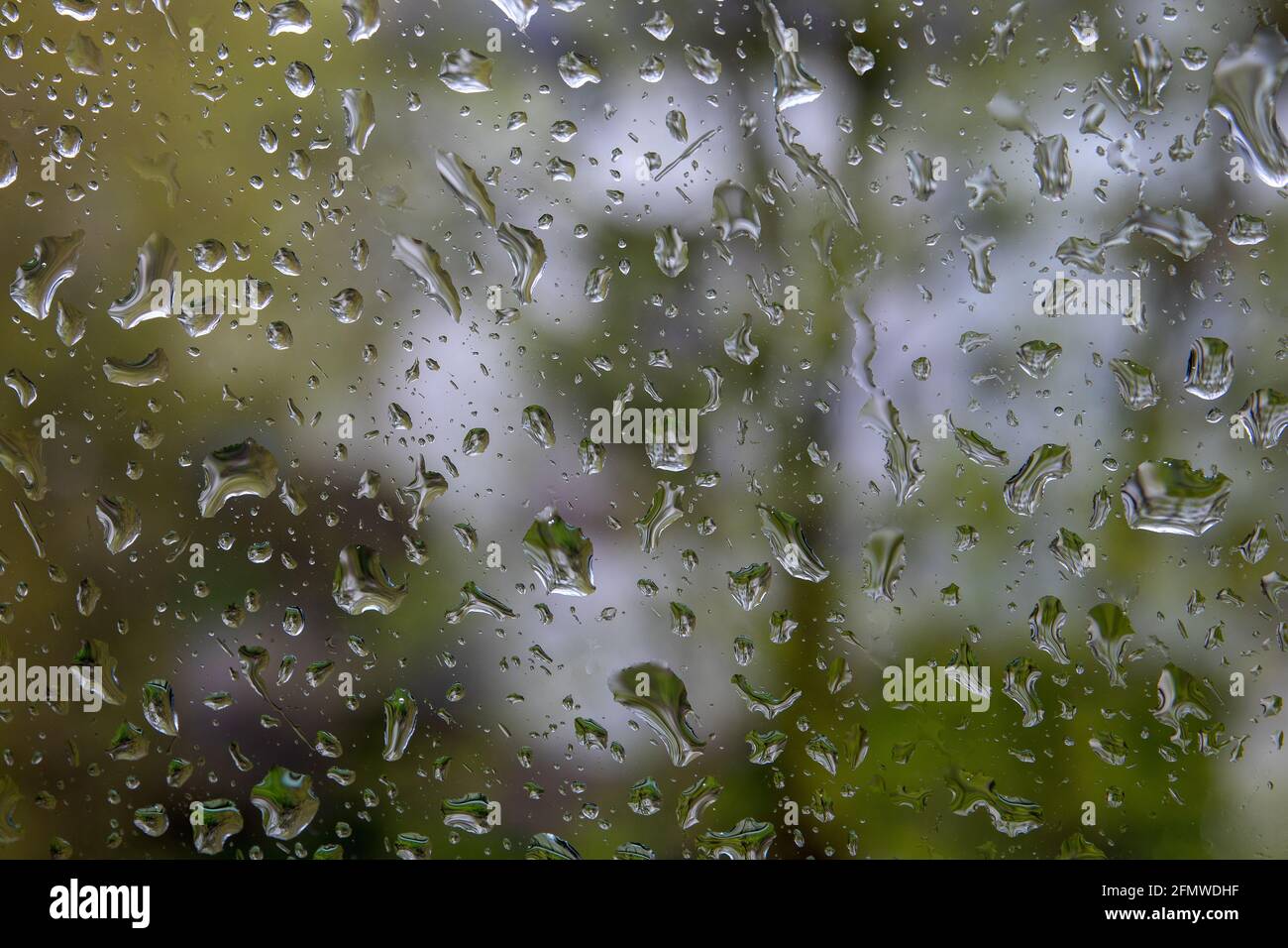 Water drops in the rain on the house window. Weather conditions Stock ...