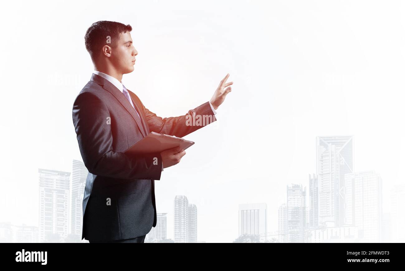 Side view of manager in business suit and tie Stock Photo - Alamy