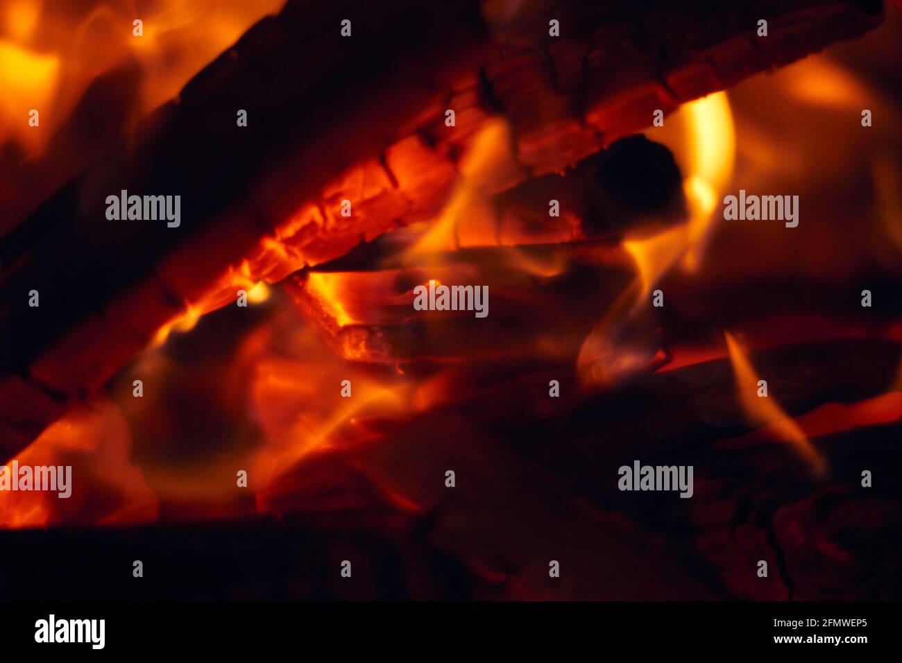 A fire burns in a fireplace, Fire to keep warm. Logs burning in Stock ...