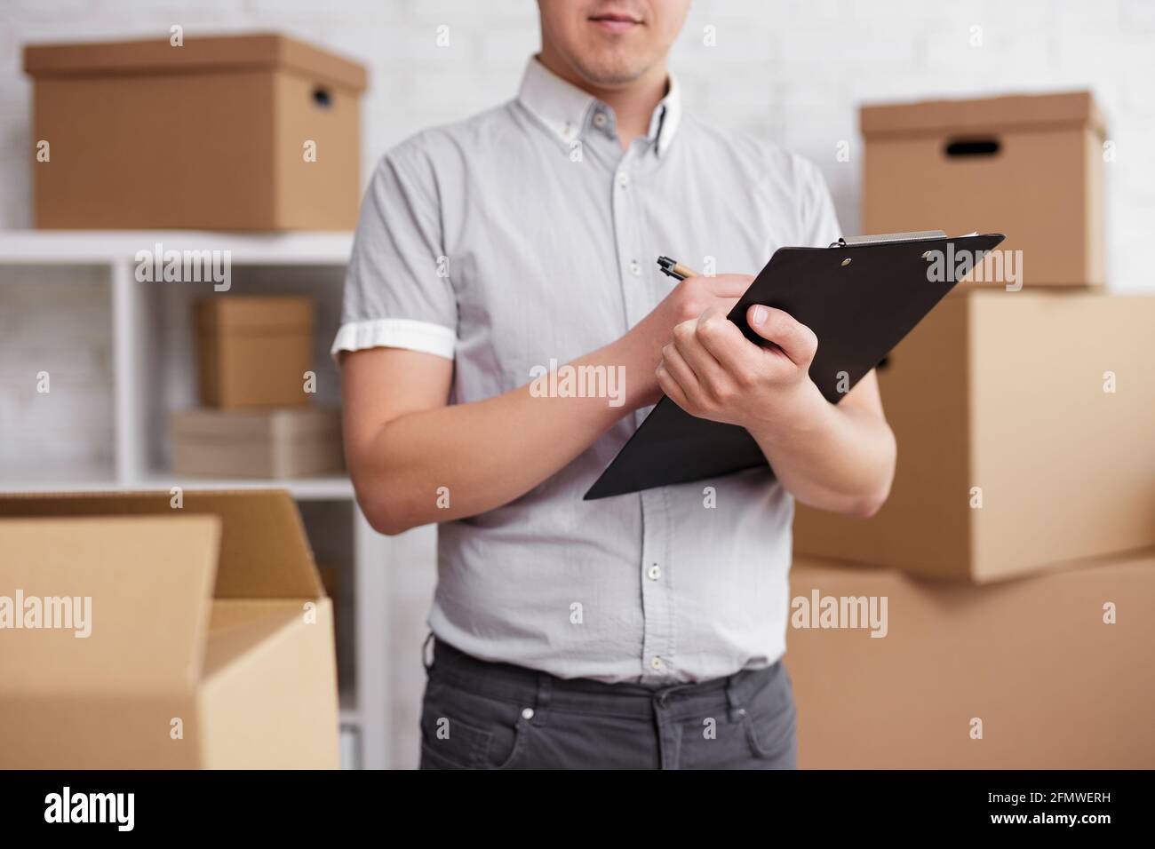 work and business people concept - close up of man in uniform checking ...