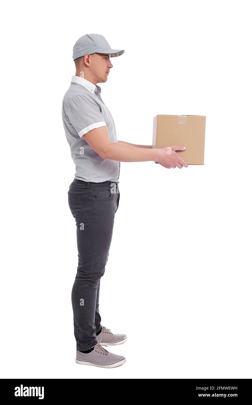full length side view of postman giving a box isolated on white ...