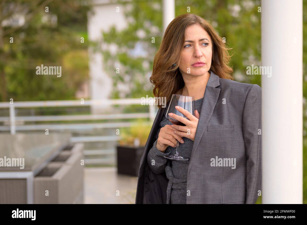 Jacket draped over shoulders hi-res stock photography and images - Alamy
