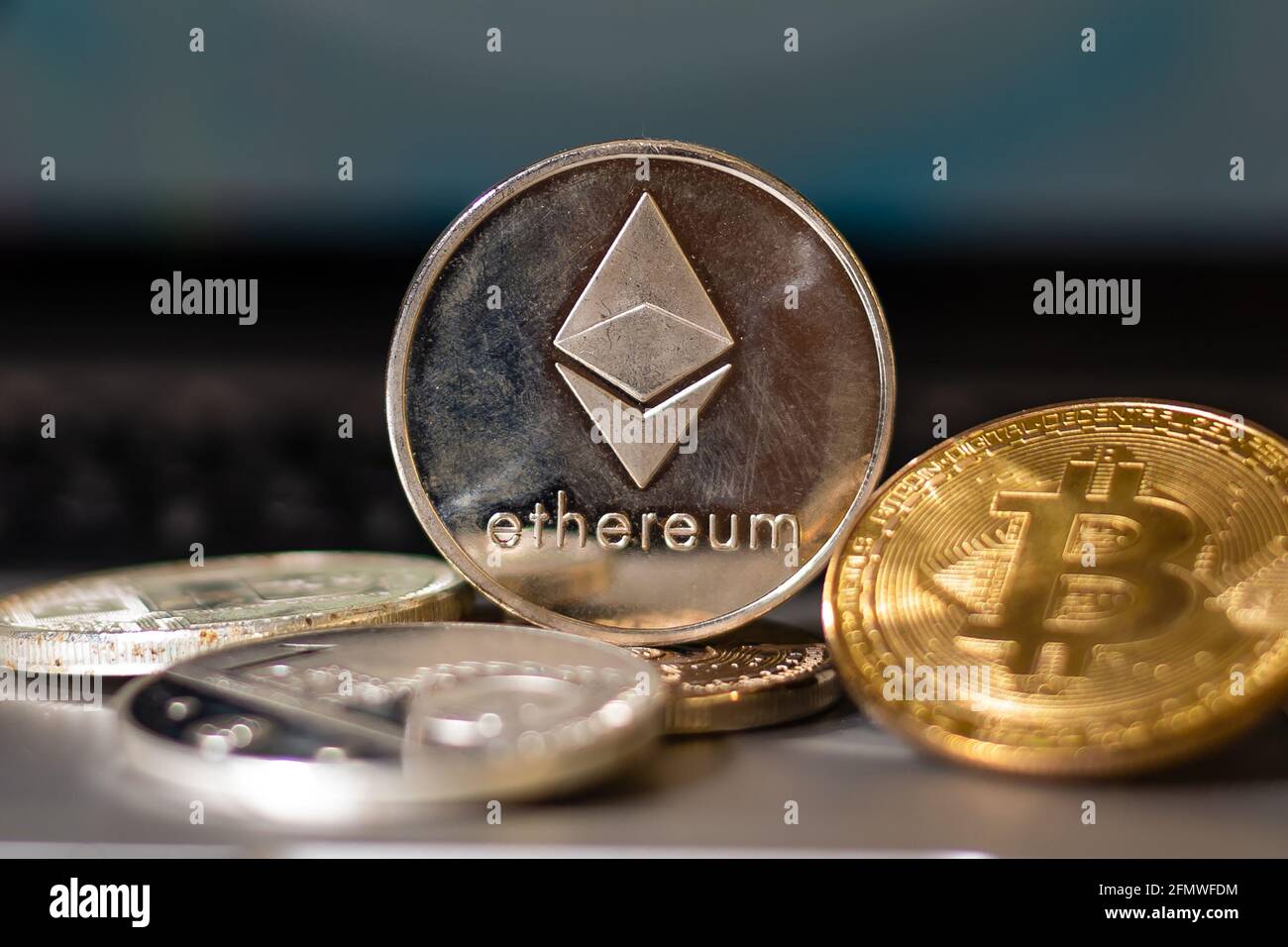 ETHEREUM ETH cryptocurrency silver ethereum coin on the background of ...