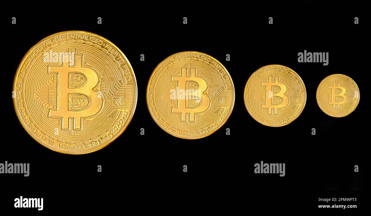Bitcoin falling down concept isolated on black background. Golden ...