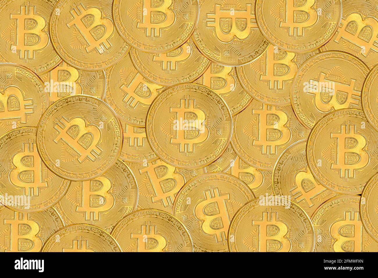 Lots of bitcoin looks like wallpaper Stock Photo - Alamy