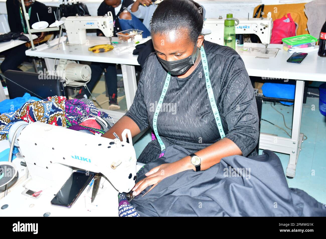 African seamstress sews clothes. Workplace of tailor Stock Photo - Alamy
