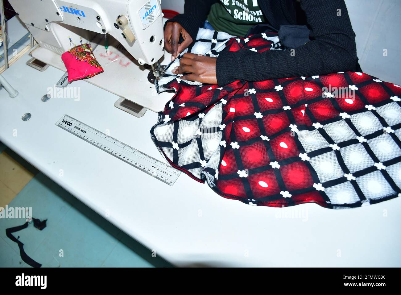African seamstress sews clothes. Workplace of tailor Stock Photo - Alamy