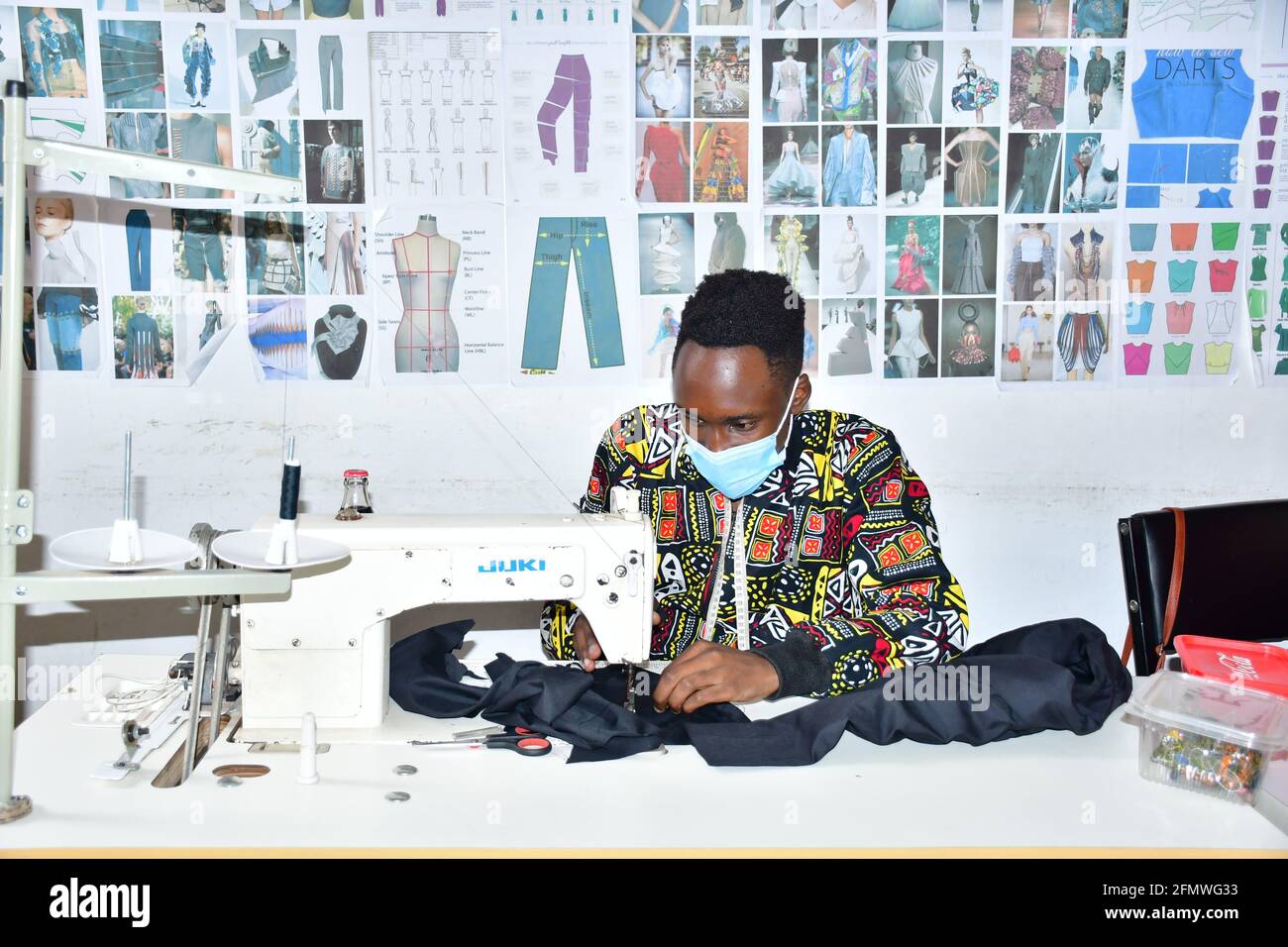 African seamstress sews clothes. Workplace of tailor Stock Photo - Alamy