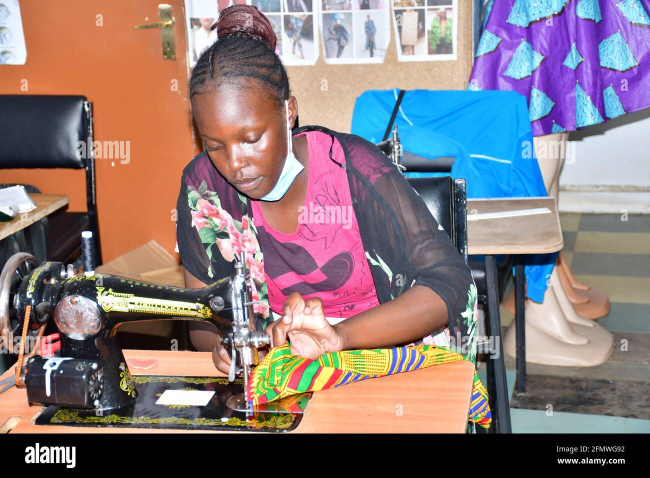 African seamstress sews clothes. Workplace of tailor Stock Photo - Alamy